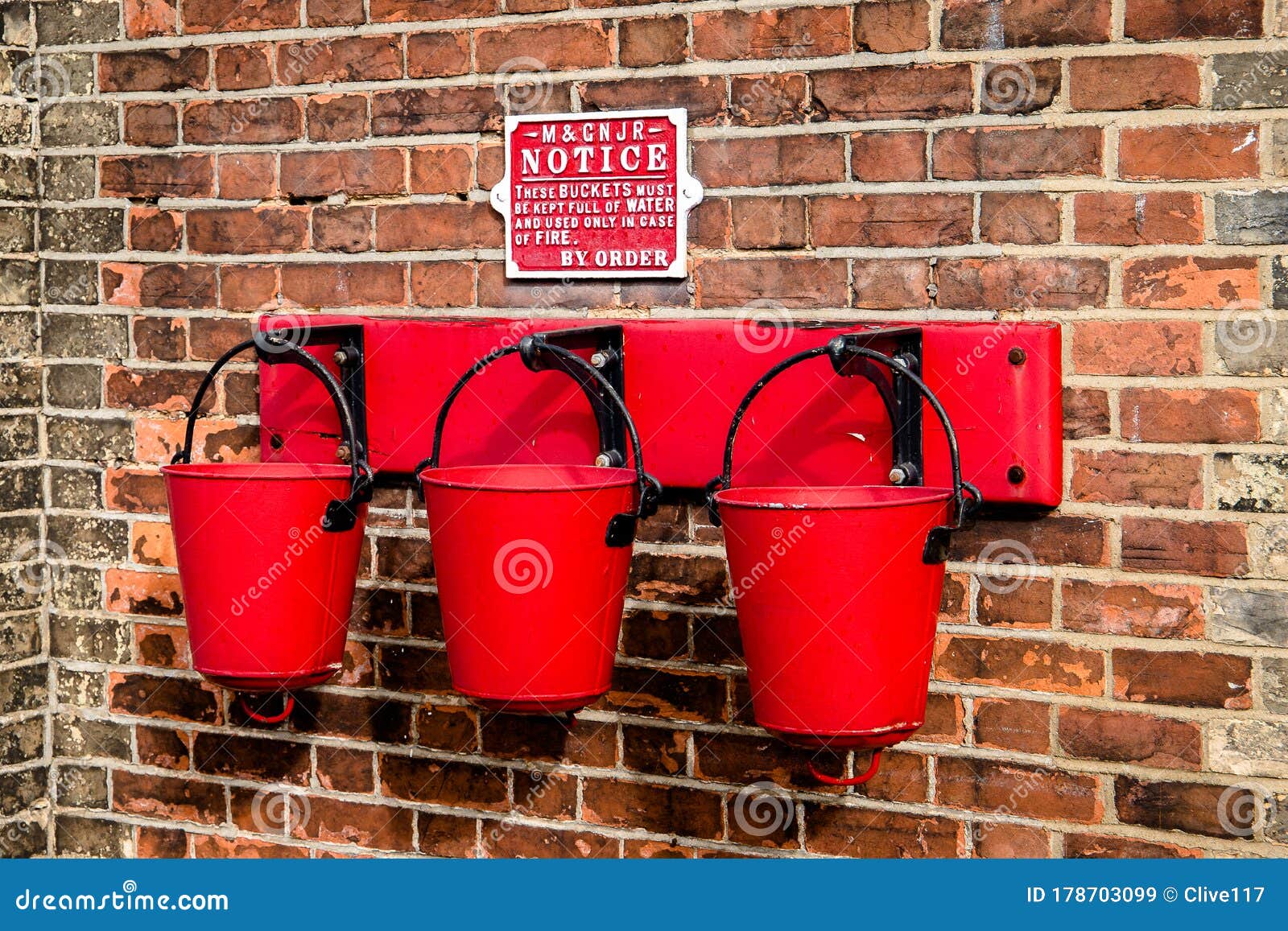 Fire Buckets Hanging on the Wall. Stock Image - Image of building ...