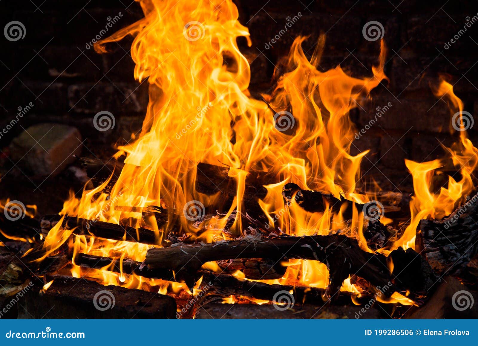 Fire Burning in a Brick Fireplace. Red and Yellow Flames Stock Photo ...