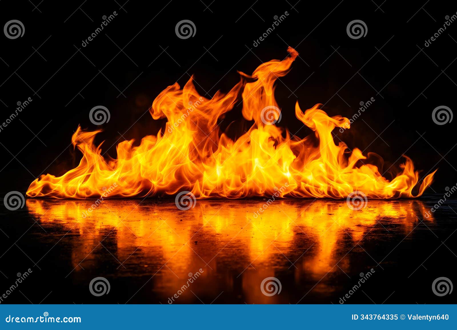 A Fire is Burning in the Dark with a Reflection in the Water Stock ...