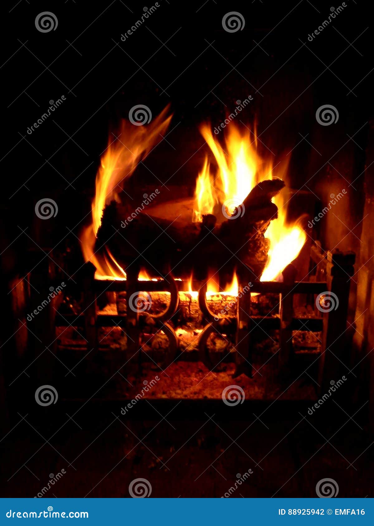Fire Burning in a Grate 1 stock photo. Image of orange - 88925942