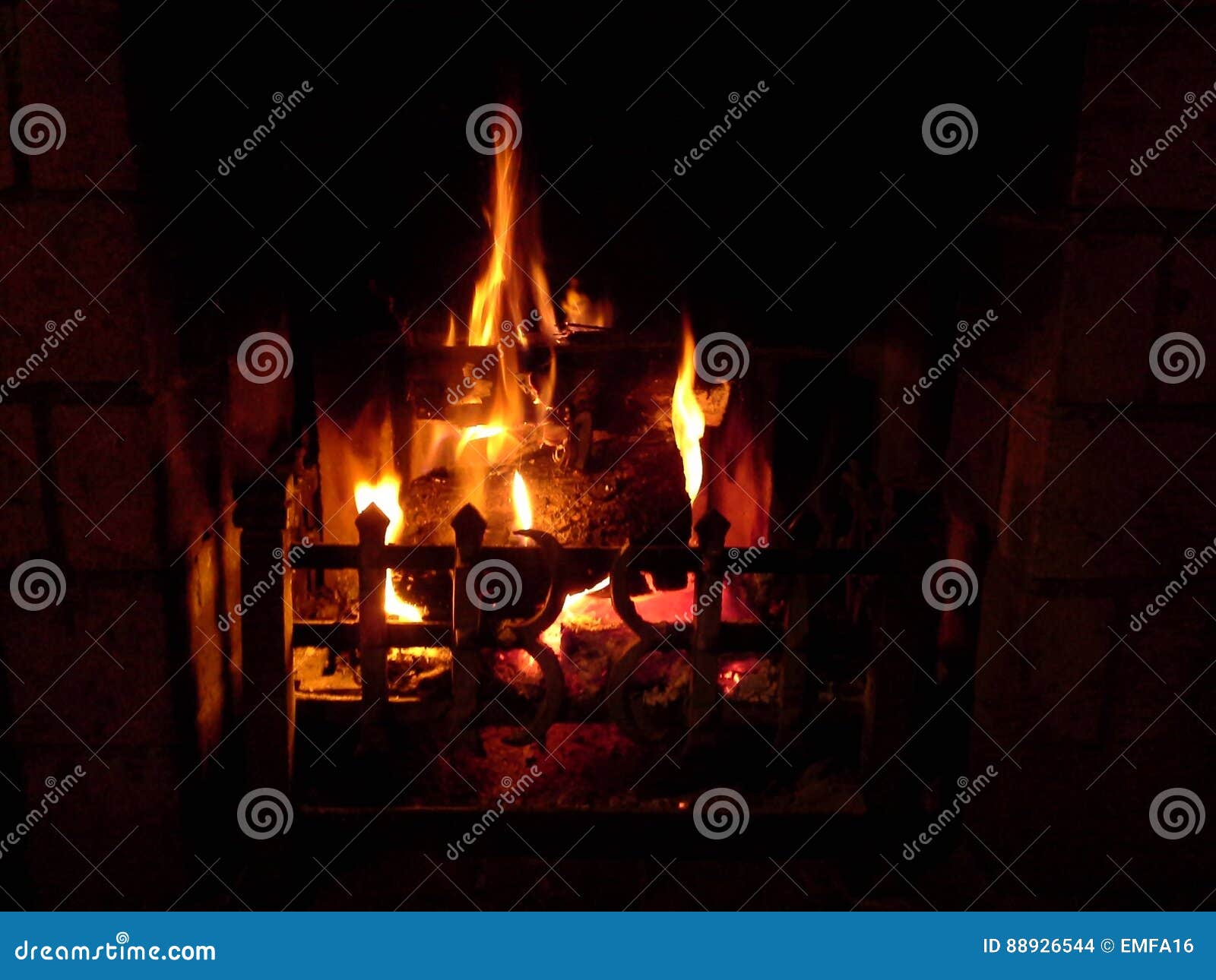 Fire Burning in a Grate 2 stock photo. Image of fireplace - 88926544