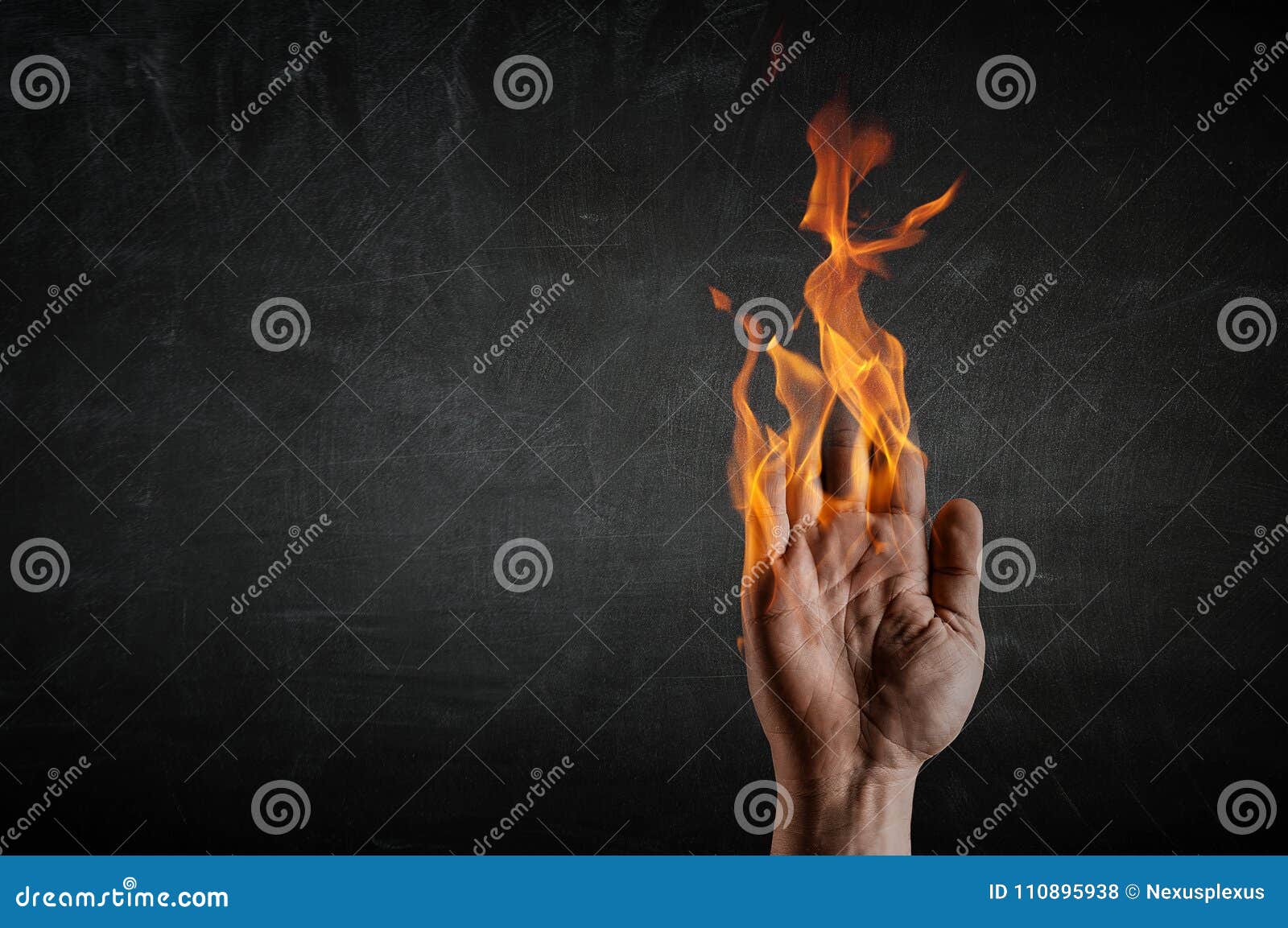 Fire burning in his hands stock photo. Image of holding - 110895938