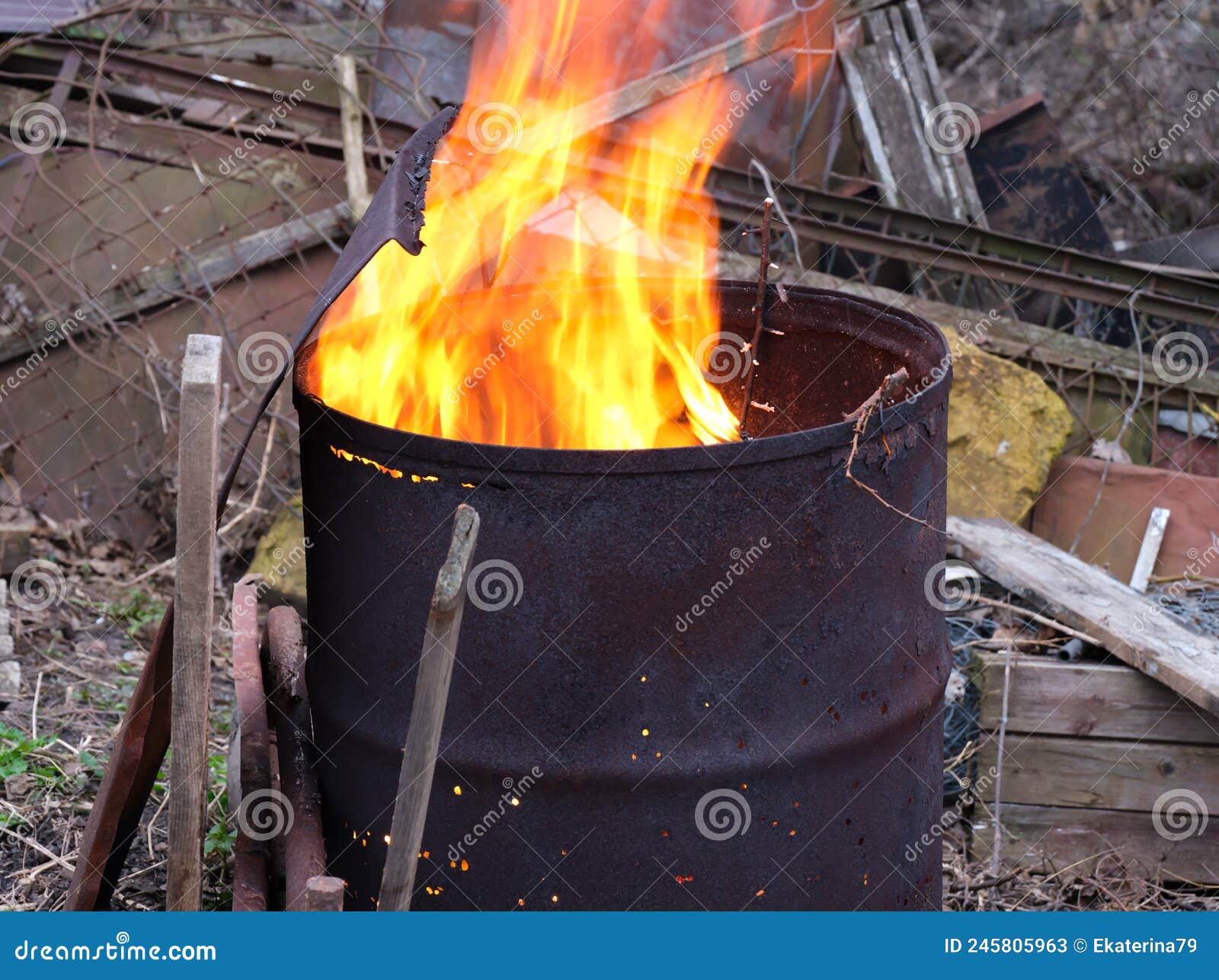 Fire Burning Inside an Old Rusty Barrel Outdoors Stock Image - Image of ...