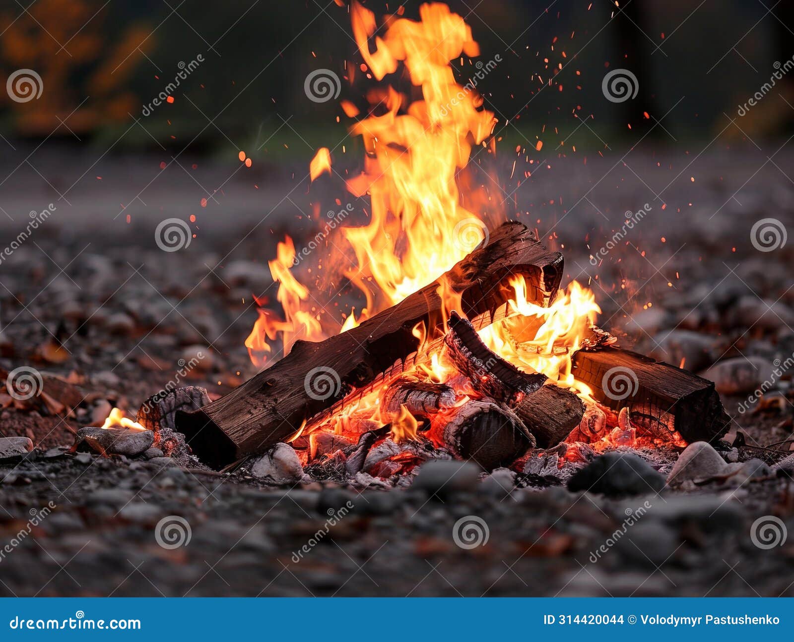 A Fire is Burning in the Middle of a Gravel Road Stock Photo - Image of ...