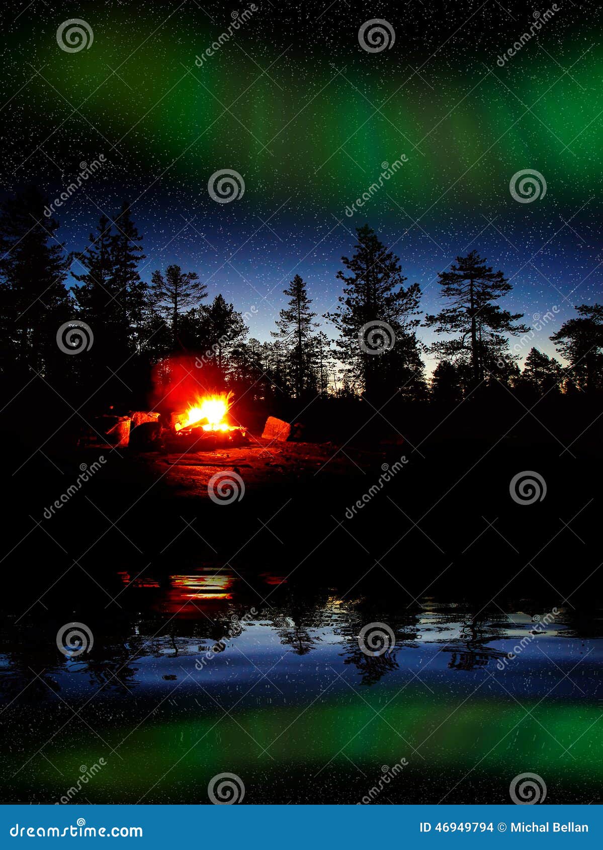 Fire Burning at Night in a Forest with Northern Lights Stock Photo ...
