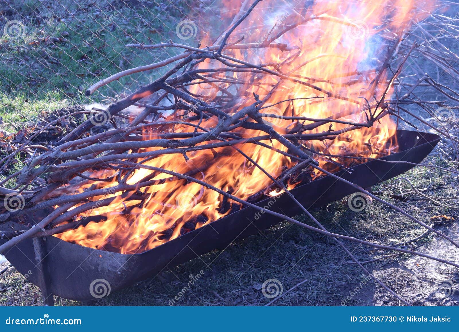 A Fire is Burning in a Tin Trough Stock Photo - Image of soil, iron ...