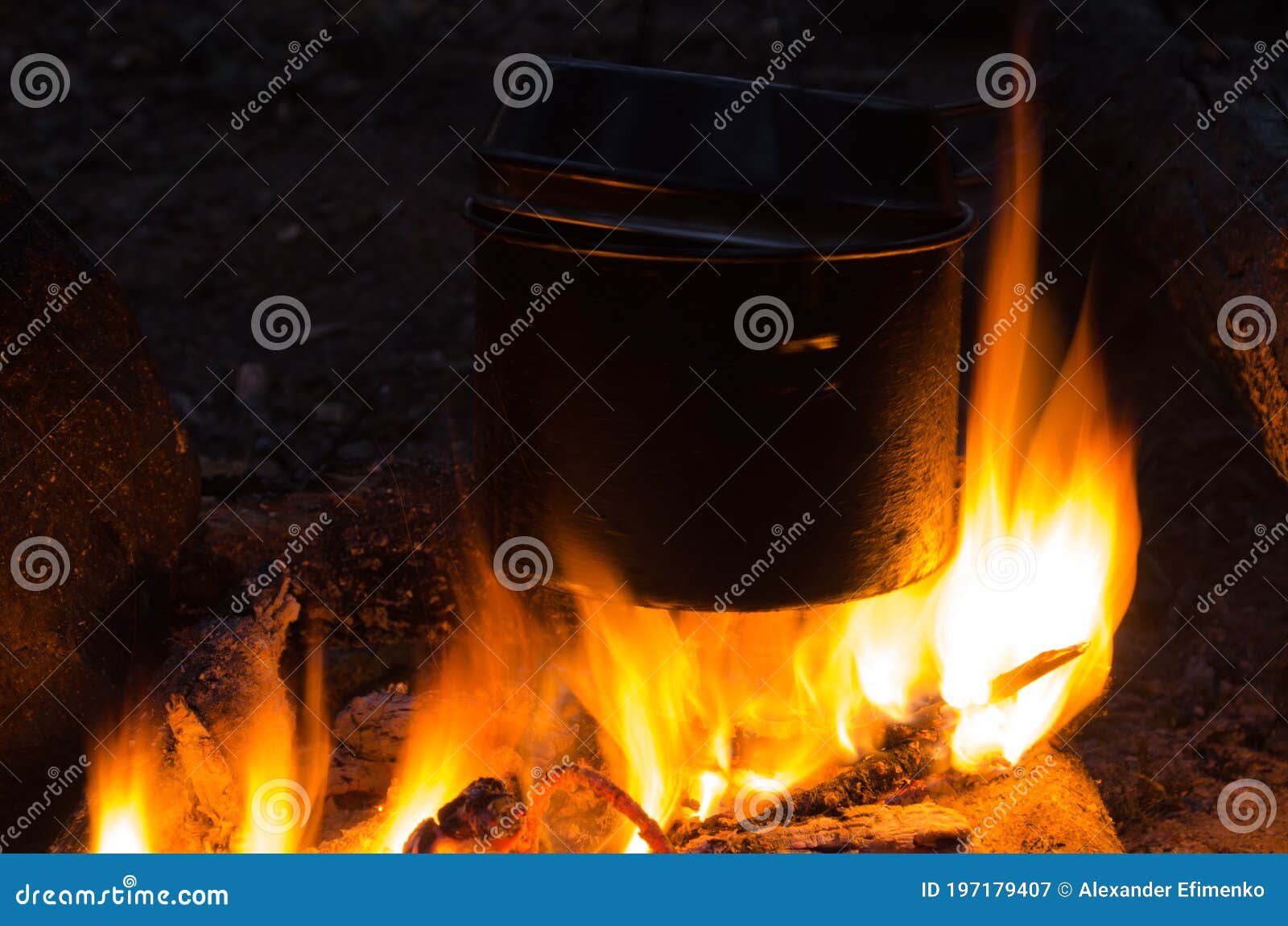 Fire Burns in the Campaign. Pot of Tea by the Fire Stock Image - Image ...