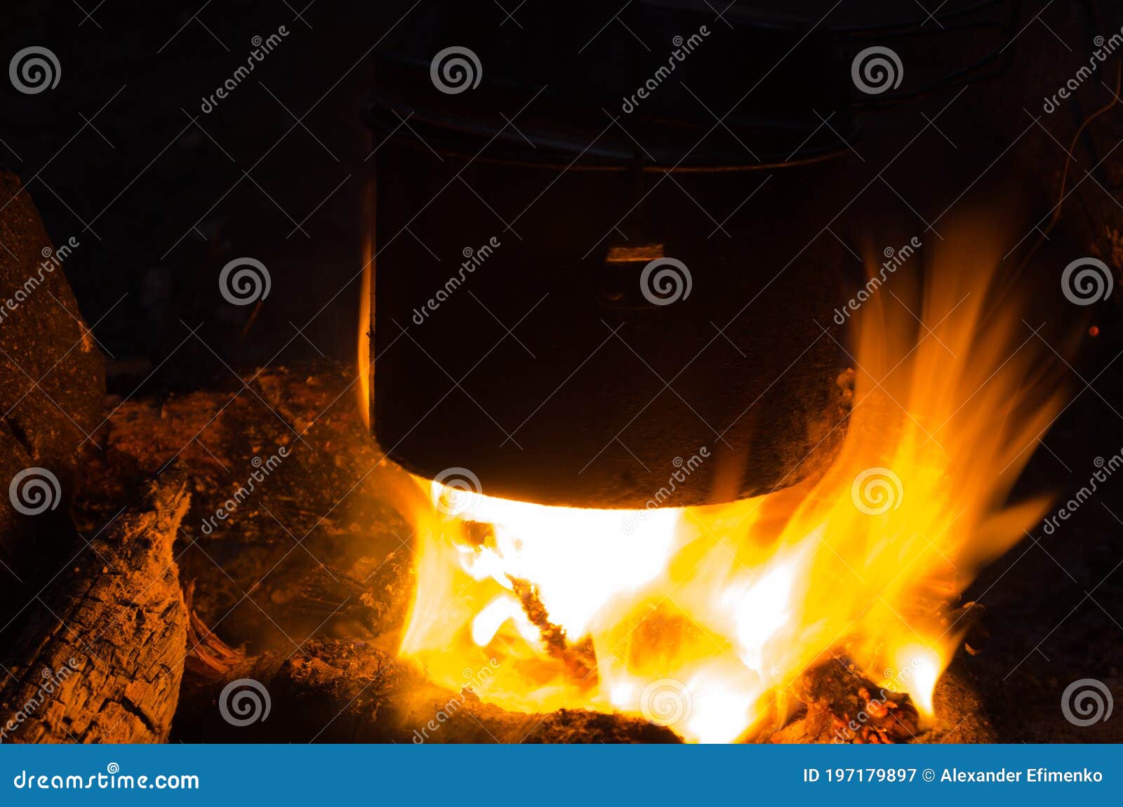 Fire Burns in the Campaign. Pot of Tea by the Fire Stock Image - Image ...