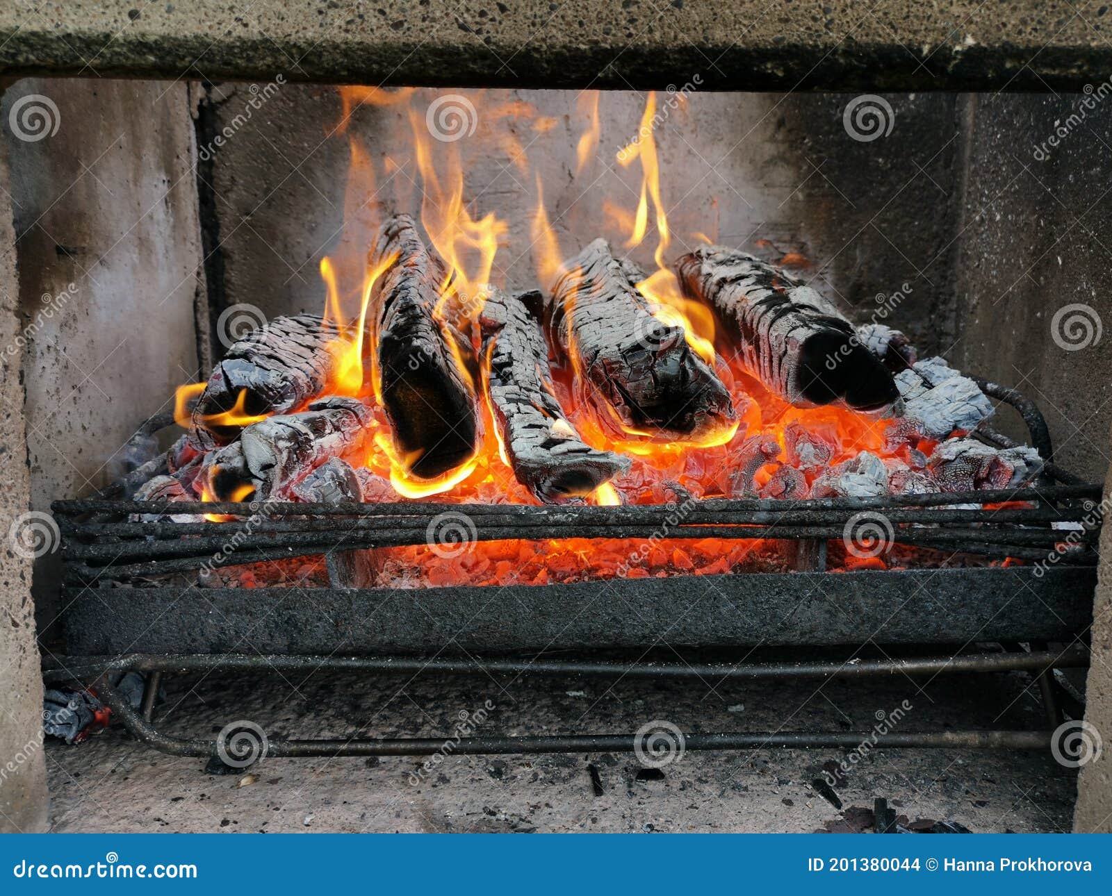 Fire burns in the stove stock photo. Image of orange - 201380044