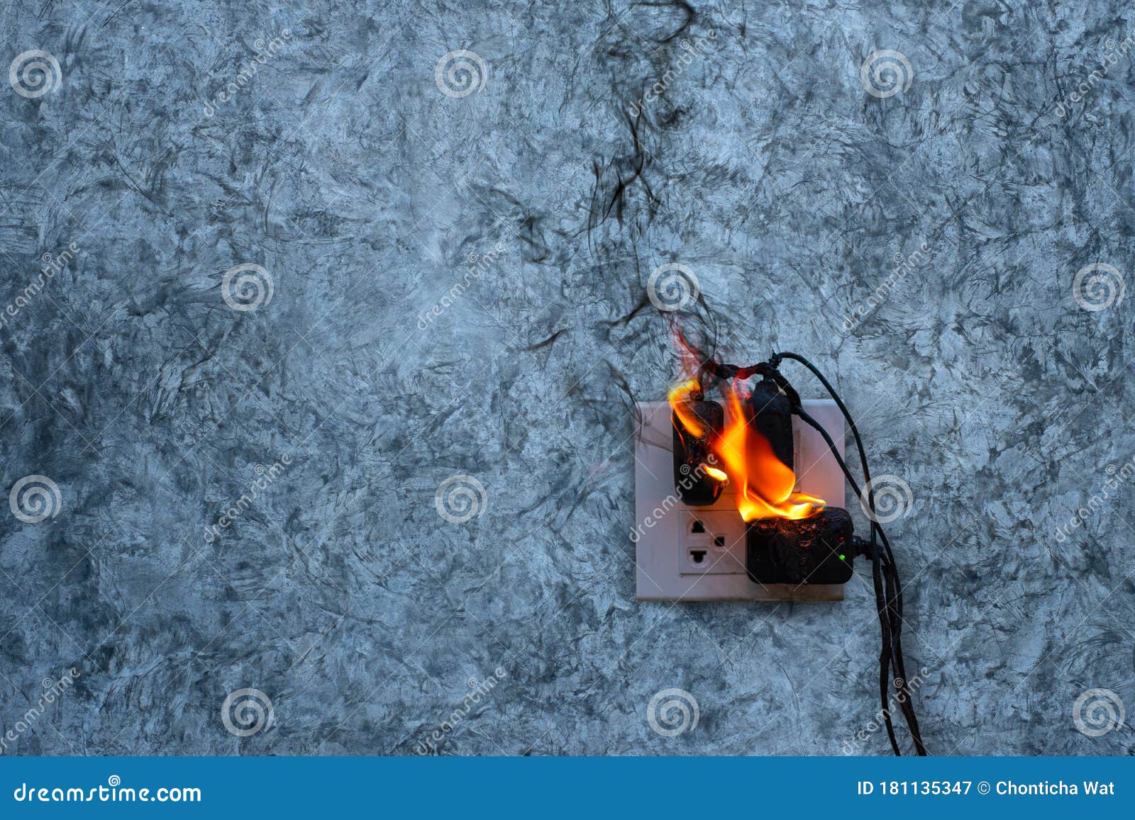On Fire Charger Adapter on the Concrete Wall Exposed Concrete ...