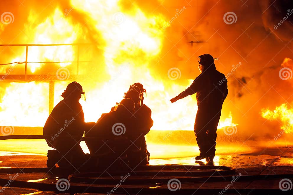 Fire Chief Giving Instructions To Firefighters during a Firefighting ...