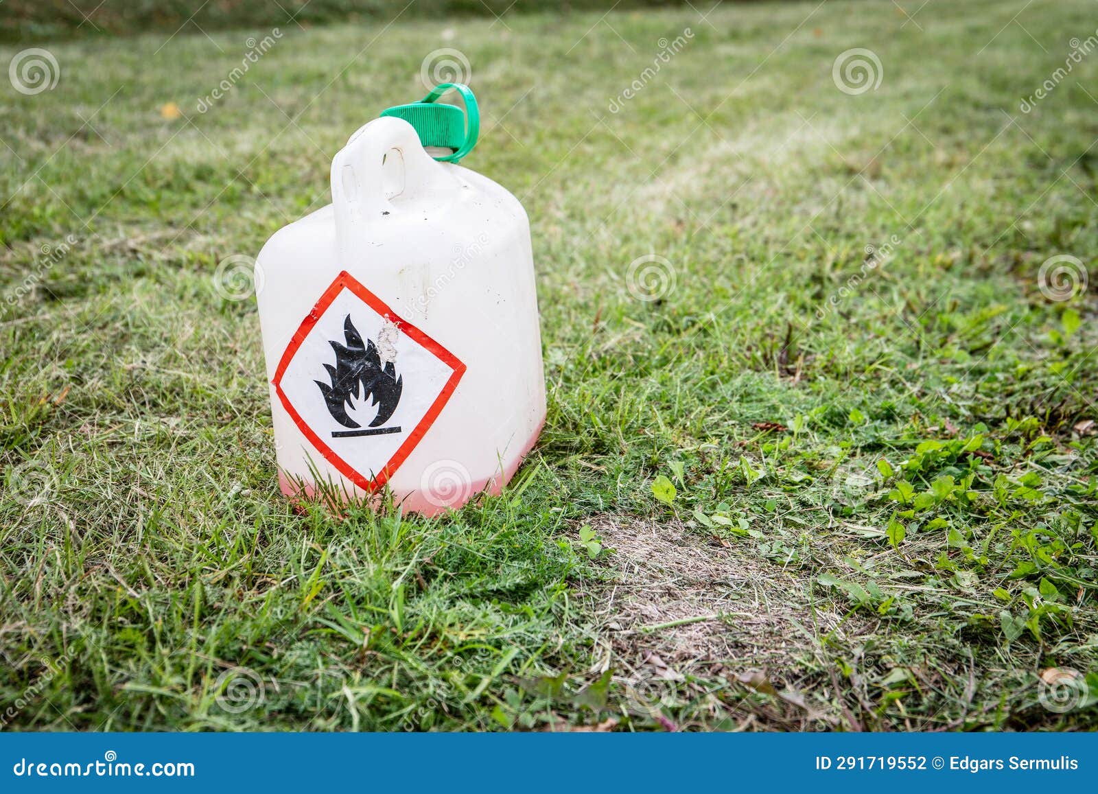 Fire Danger Sign. Plastic Can in Cut Grass Stock Photo - Image of ...