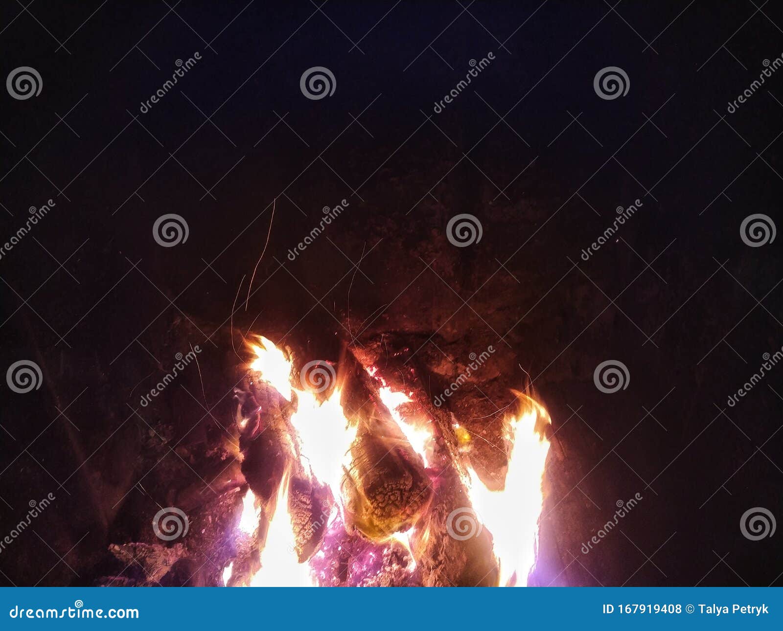 Fire in the dark of night stock photo. Image of dark - 167919408