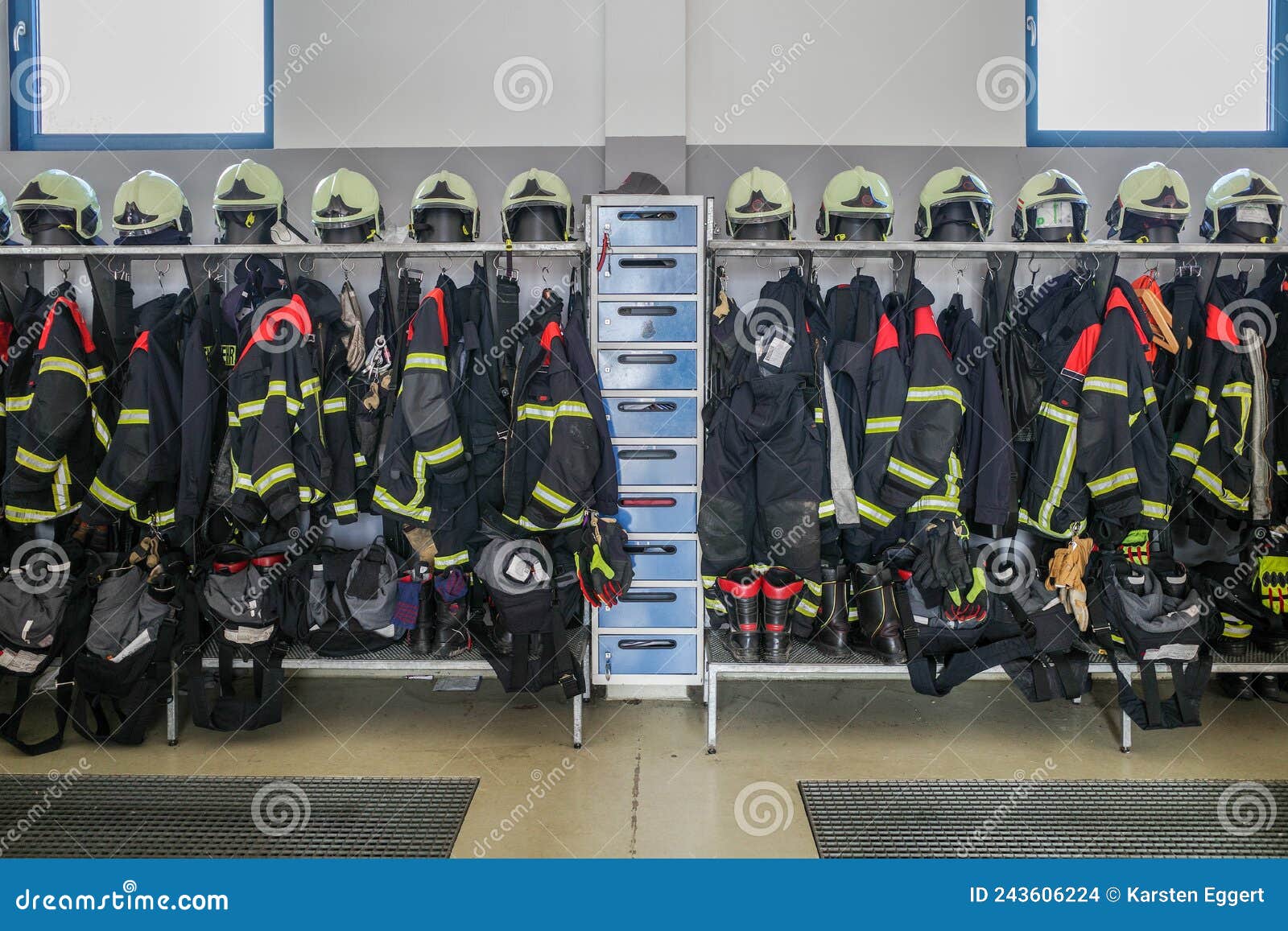 In the Fire Department Hang Many Uniforms of Firefighters Next To Each ...