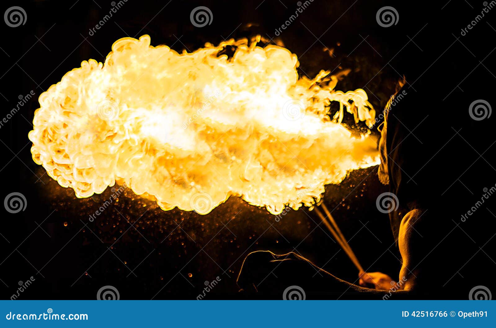 Fire eater from behind editorial photo. Image of fire - 42516766