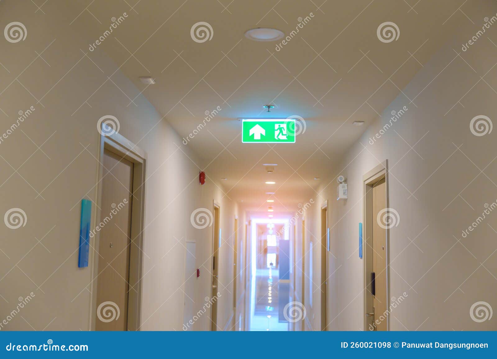Fire Emergency Exit Sign on the Wall Background Inside Building. Safety ...