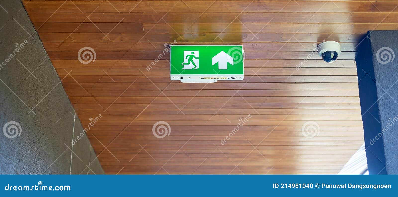 Fire Emergency Exit Sign on the Wall Background Inside Building. Safety ...