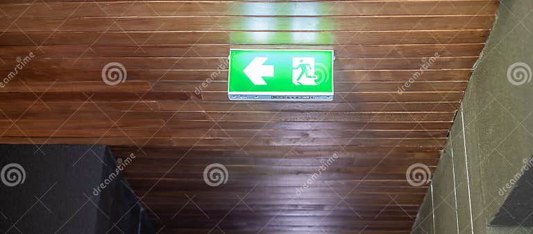 Fire Emergency Exit Sign on the Wall Background Inside Building. Safety ...