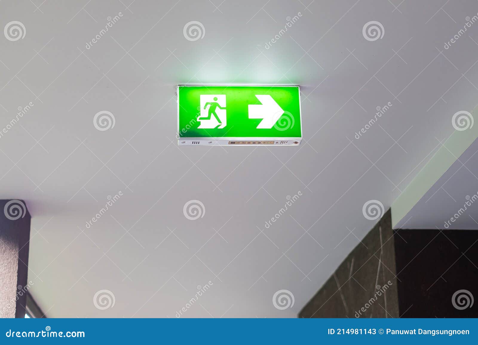 Fire Emergency Exit Sign on the Wall Background Inside Building. Safety ...