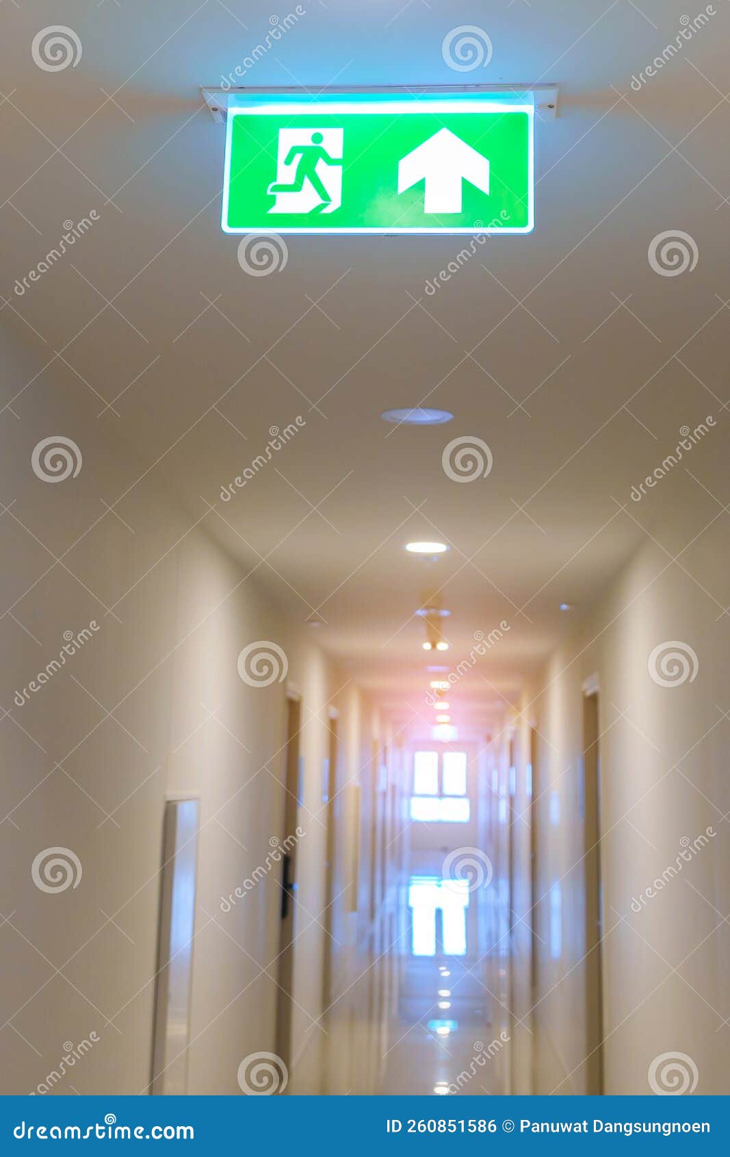 Fire Emergency Exit Sign on the Wall Background Inside Building. Safety ...