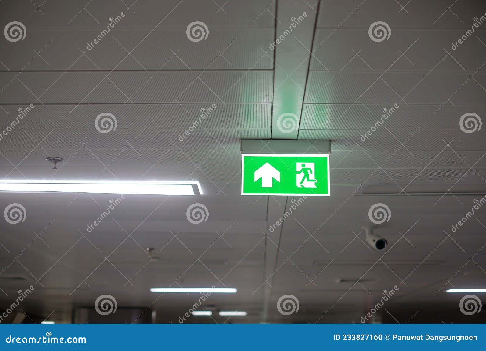 Fire Emergency Exit Sign on the Wall Inside Building at Subway Train ...