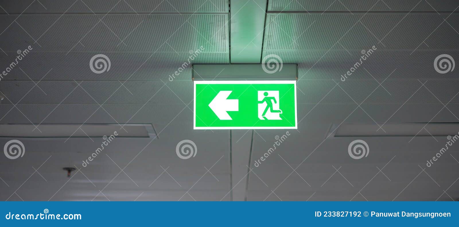 Fire Emergency Exit Sign on the Wall Inside Building at Subway Train ...