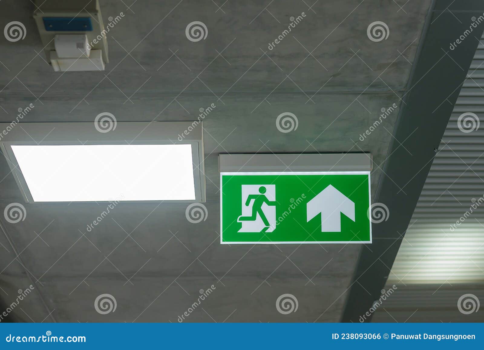 Fire Emergency Exit Sign on the Wall Inside Building at Subway Train ...