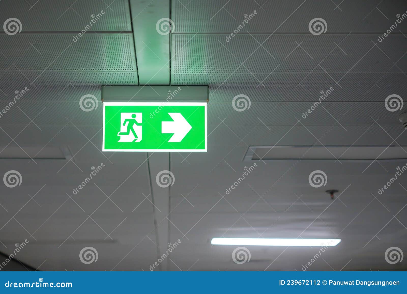 Fire Emergency Exit Sign on the Wall Inside Building at Subway Train ...