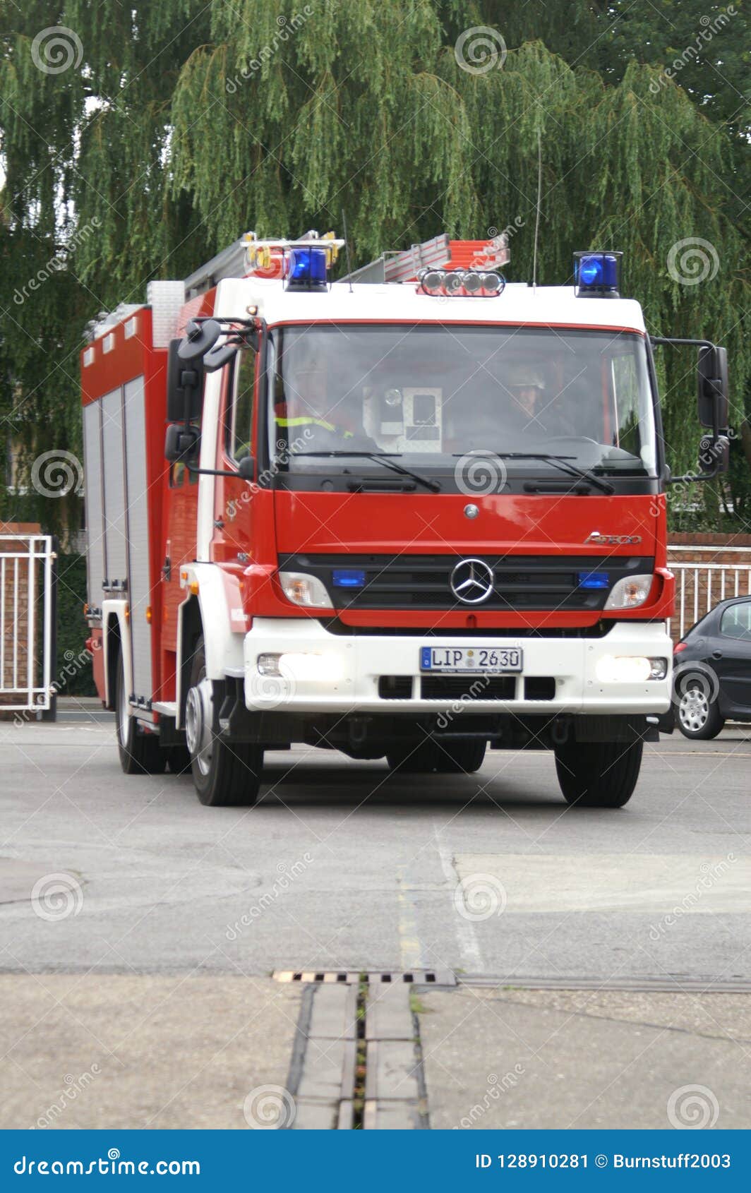 Fire engine on blue light editorial photo. Image of engine - 128910281