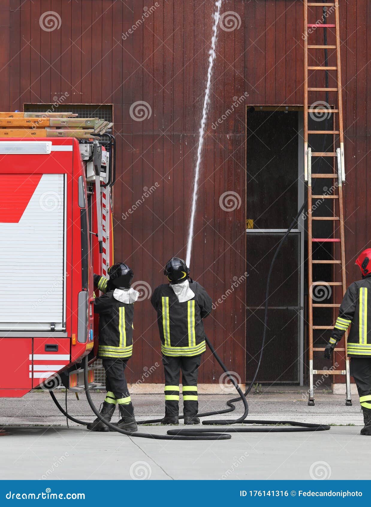 Fire Engine and the Brave Firefighters Engaged To Put Out the Fi Stock ...