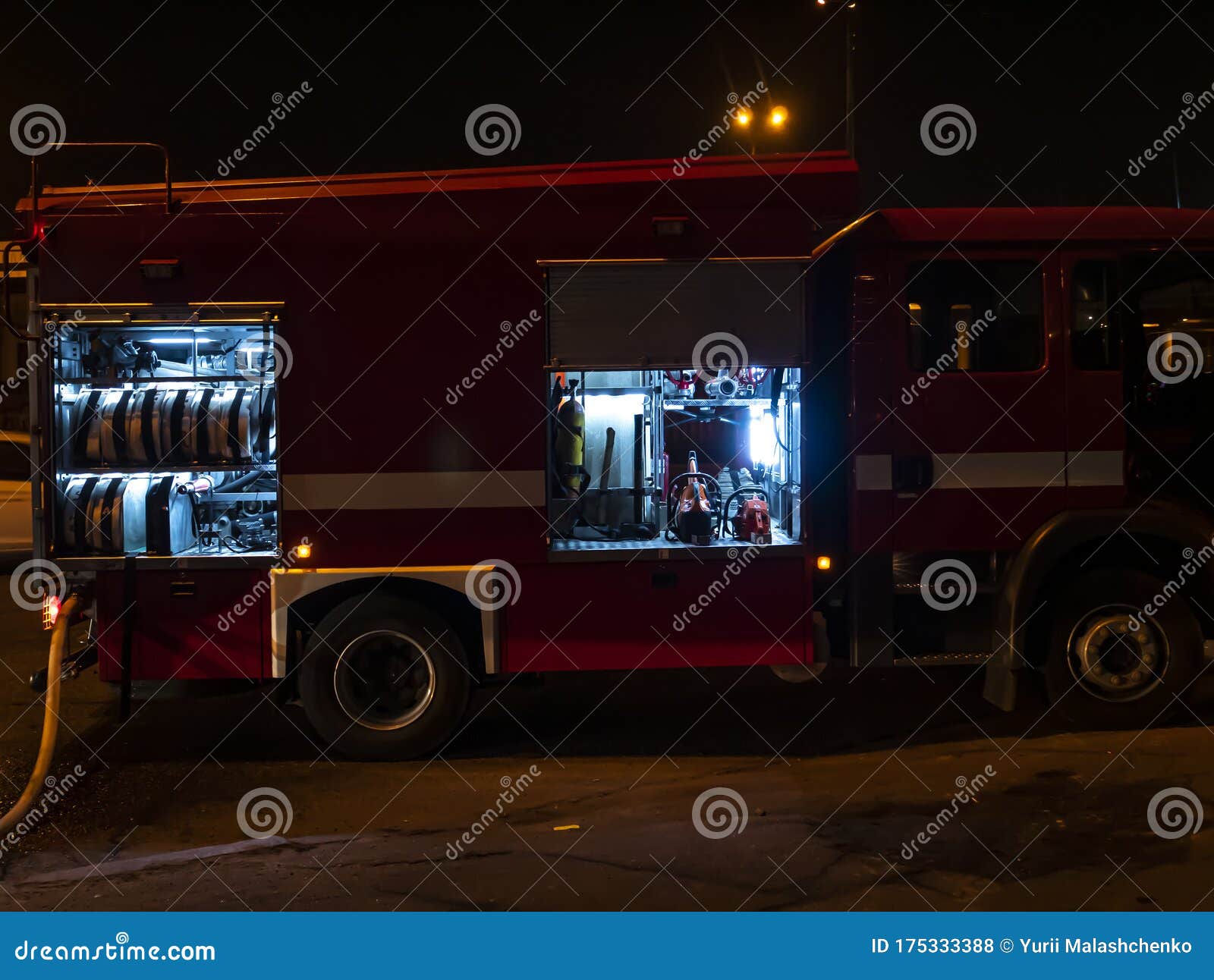Fire Engine during a Fire Extinguishing at Night Stock Photo - Image of ...