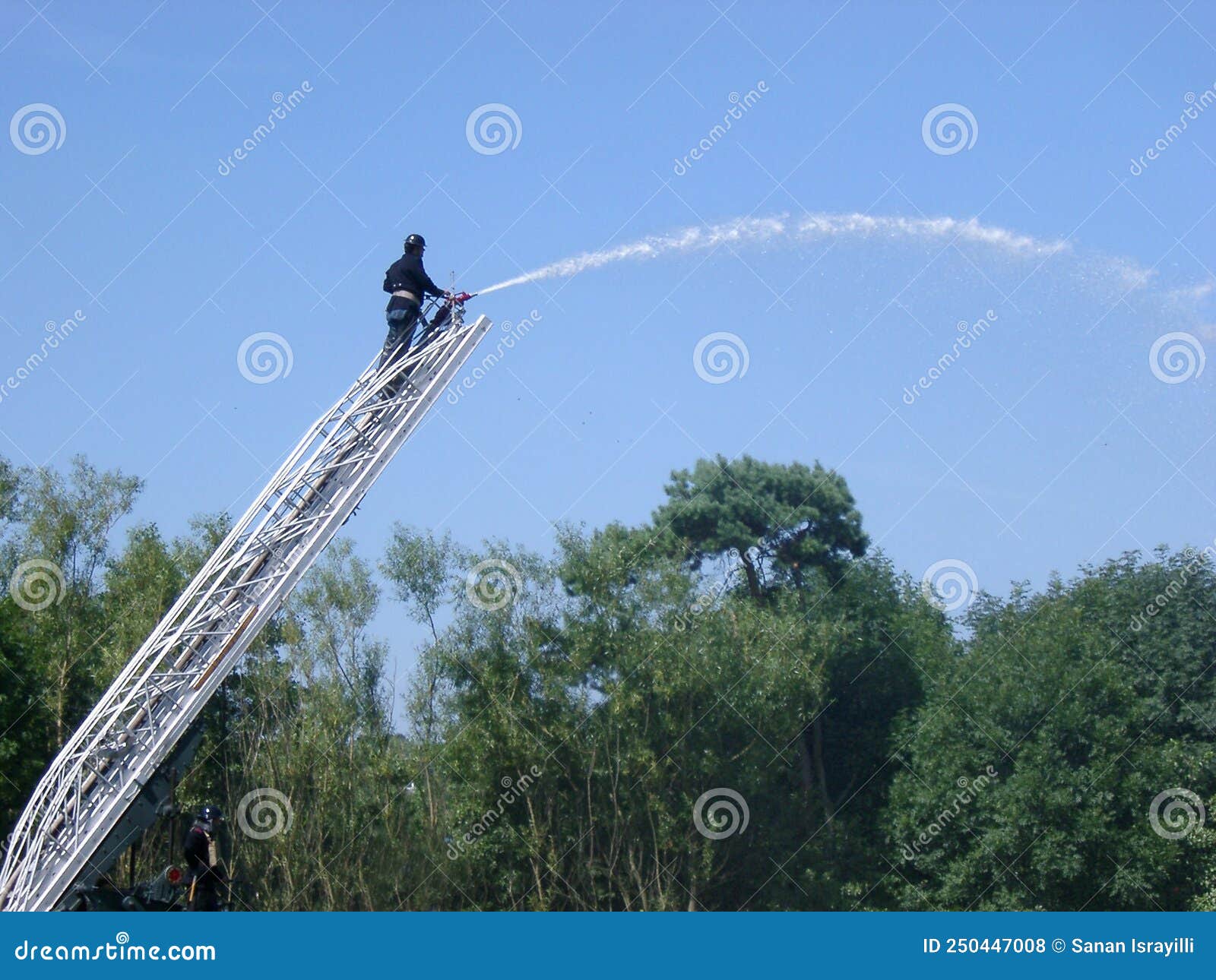 A Fire Engine Ladder, Fireman and Water from a Hose Editorial Stock ...