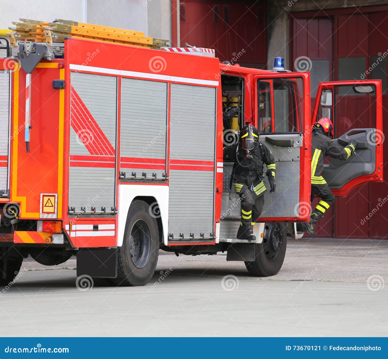 Fire Engine with Many Firefighters and Equipment for Fighting Fi Stock ...