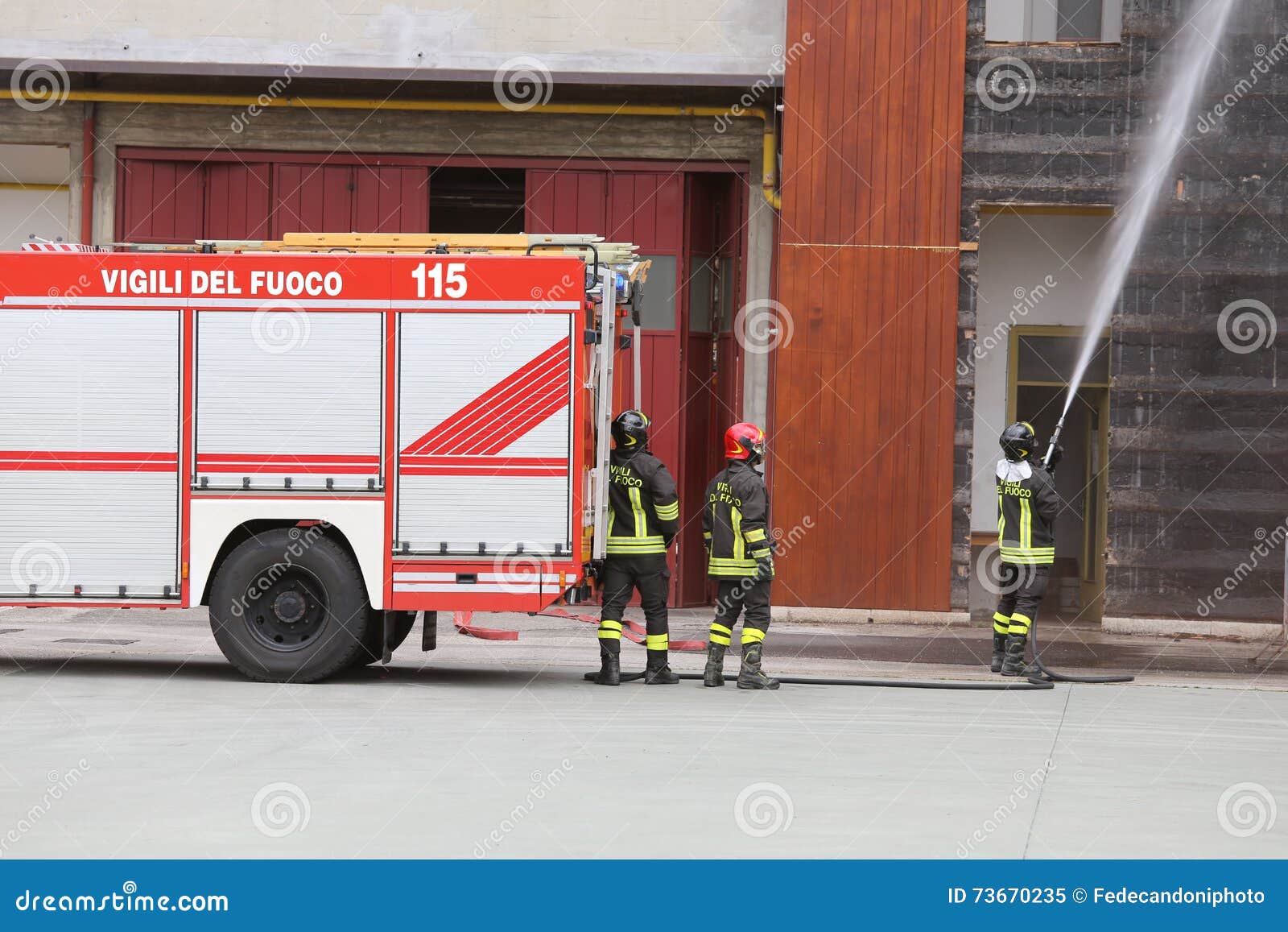 Fire Engine Pulled Up in Front of the Blazing Building Stock Image ...