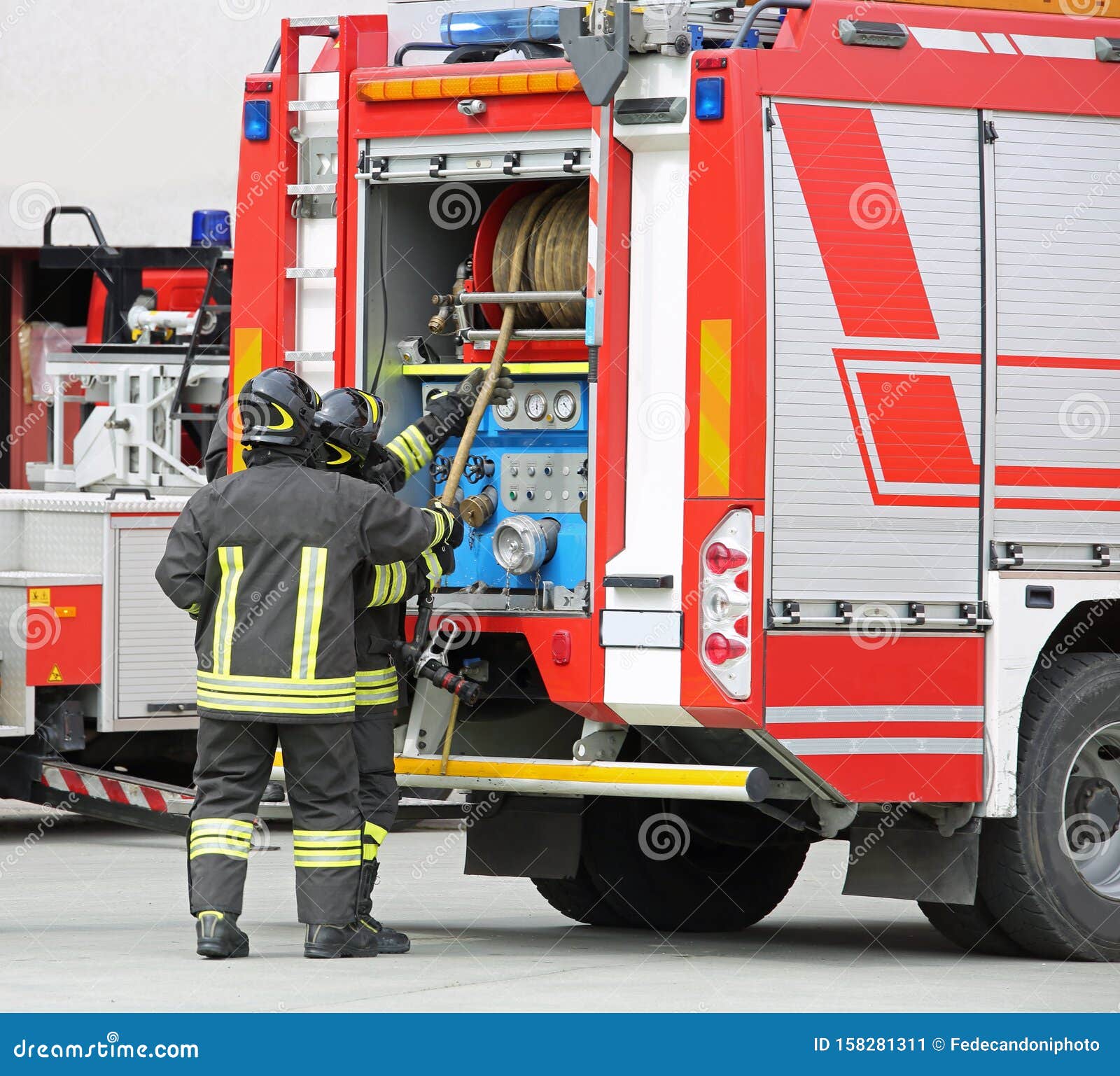 Fire Engine and Two Firemen Stock Image - Image of worker, fireman ...