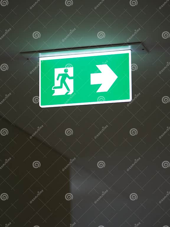 Fire Escape Sign on the Ceiling Fire Exit Arrow Symbol Stock Photo ...