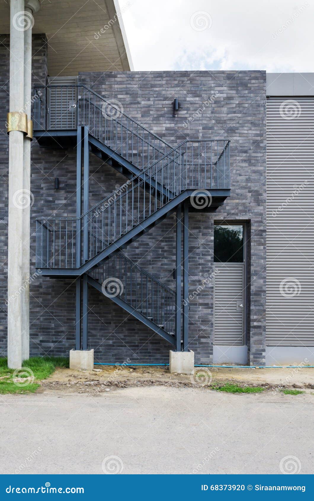 Fire Escape Staircase on the Brick Wall Stock Photo - Image of column ...