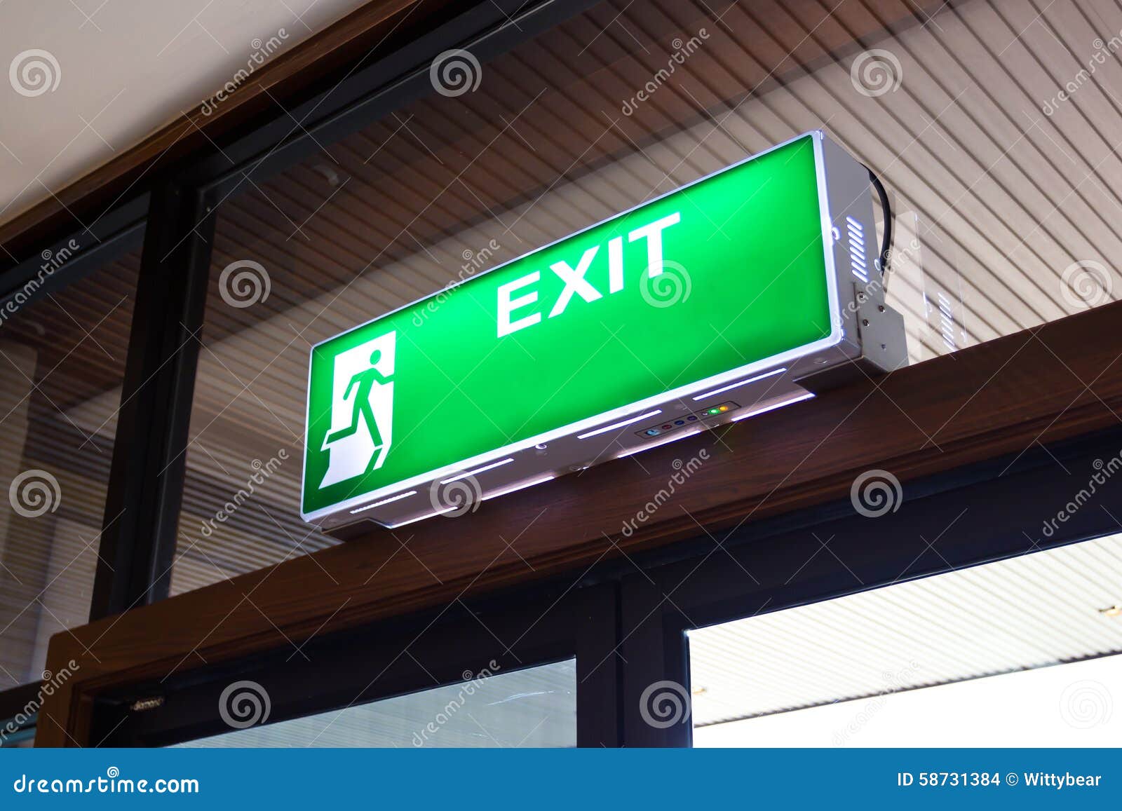 Fire exit light sign stock photo. Image of background - 58731384