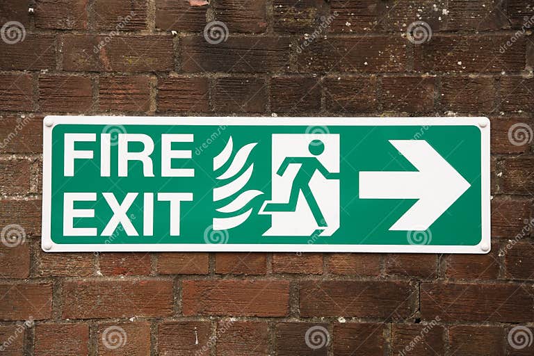 Fire exit sign stock image. Image of sign, bricks, arrow - 2628045