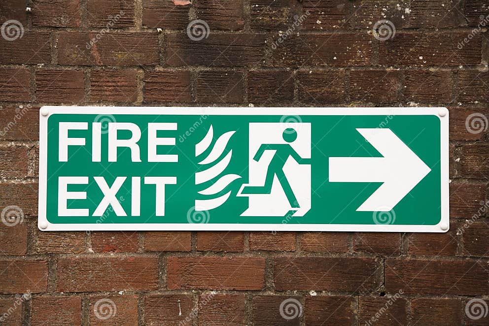 Fire exit sign stock image. Image of sign, bricks, arrow - 2628045
