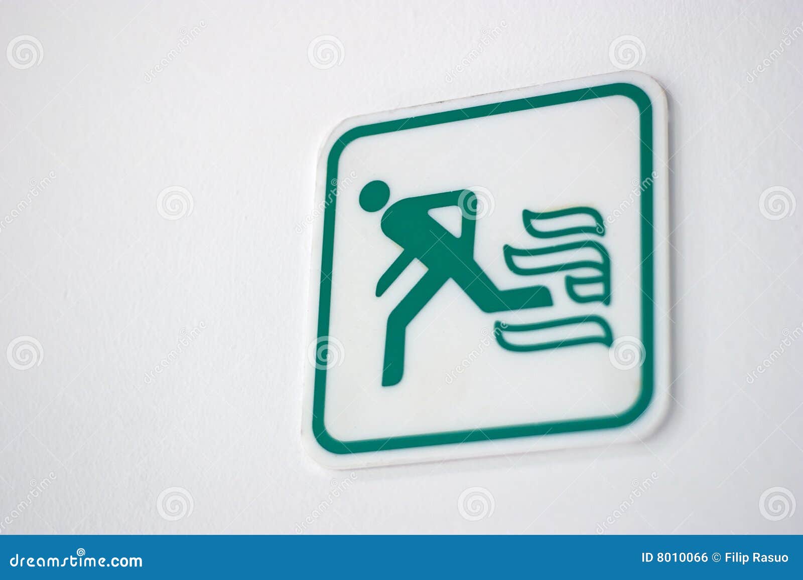 The Fire Exit Has An Exit Sign Above The Door At The End Of The Dimly ...