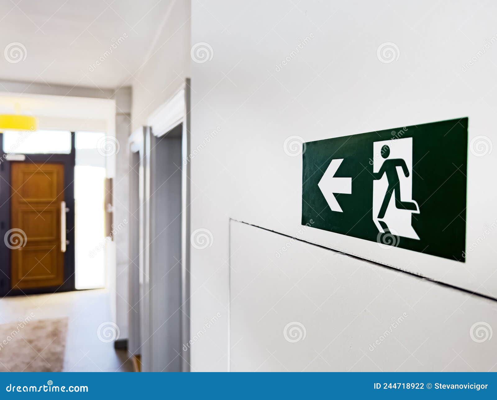 Fire Exit Sign in Apartment Building Stock Photo - Image of direction ...