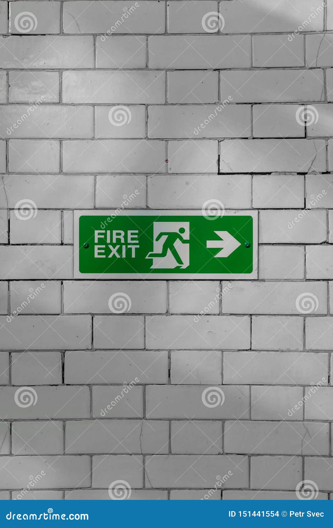 Fire Exit Sign on a Brick Wall Stock Photo - Image of safety, interior ...