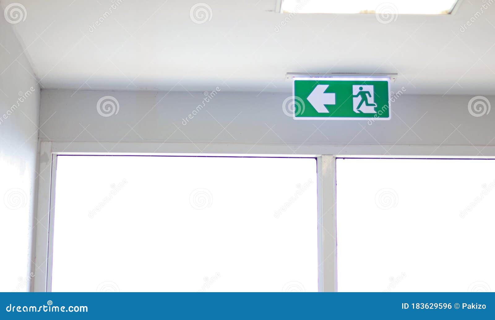 Fire Exit Sign on the Ceiling Entry the Fire Escape, Green Safety Light ...