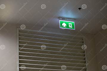Fire Exit Sign on the Ceiling beside the Exit Door on the Mall Stock ...