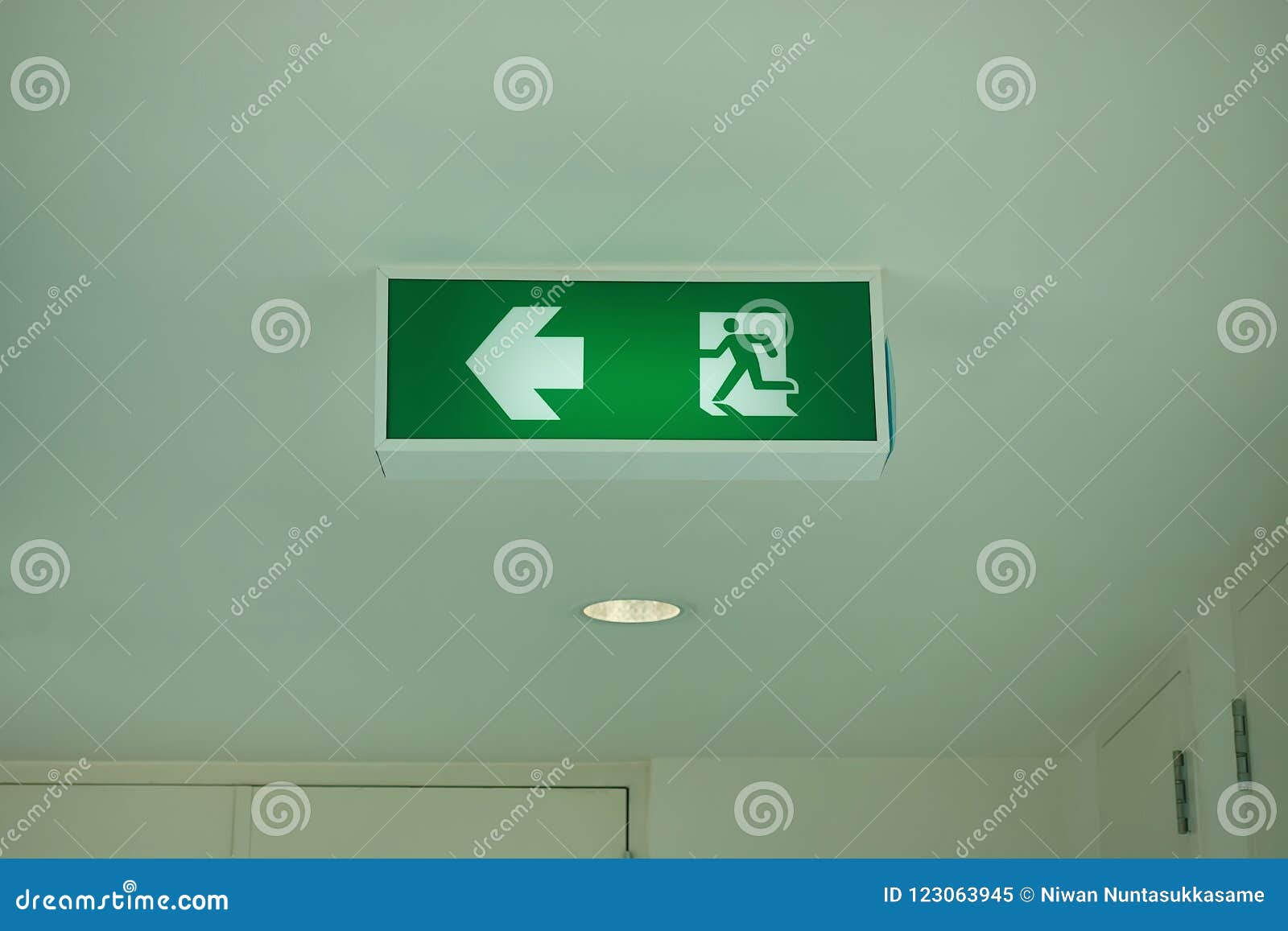 Fire Exit Sign on Ceiling in Office Stock Image - Image of indoors ...