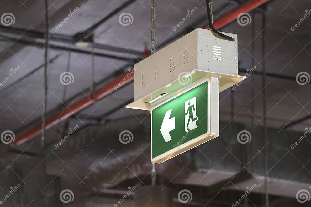 Fire Exit Sign Hanging on Top of the Building. Fire Exit Sign Stock ...