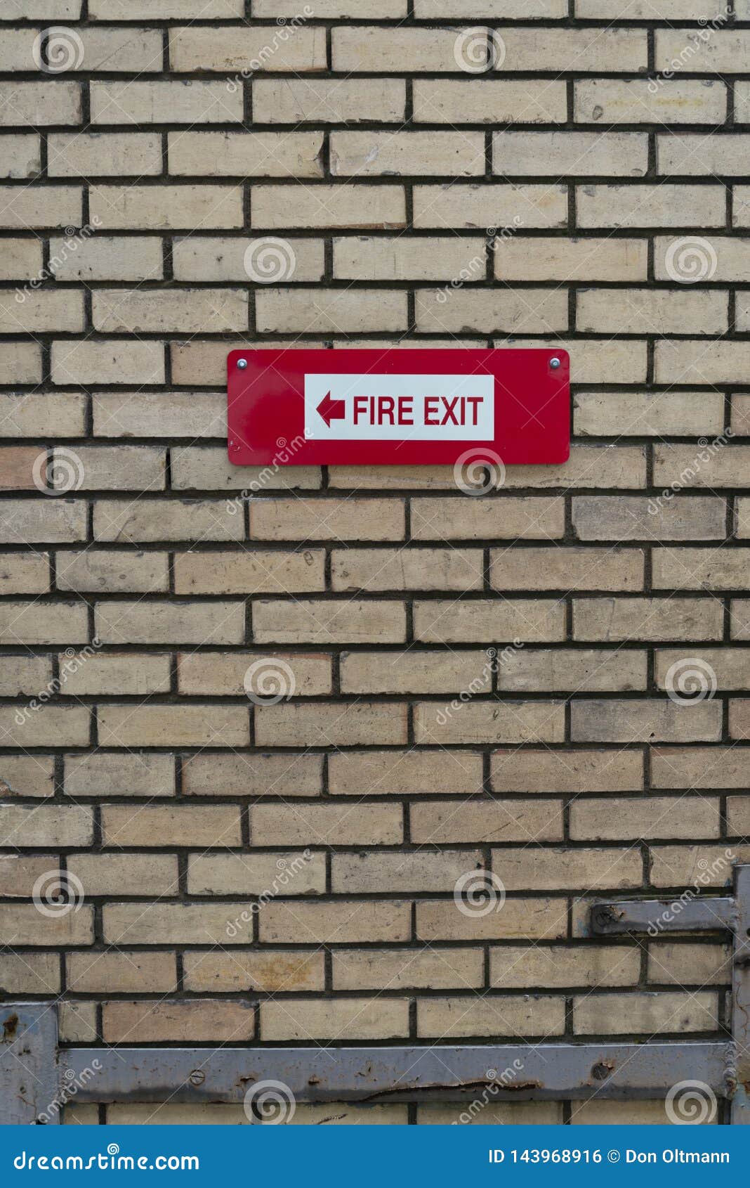 Fire Exit Sign Mounted on Brick Wall Stock Photo - Image of wall, white ...