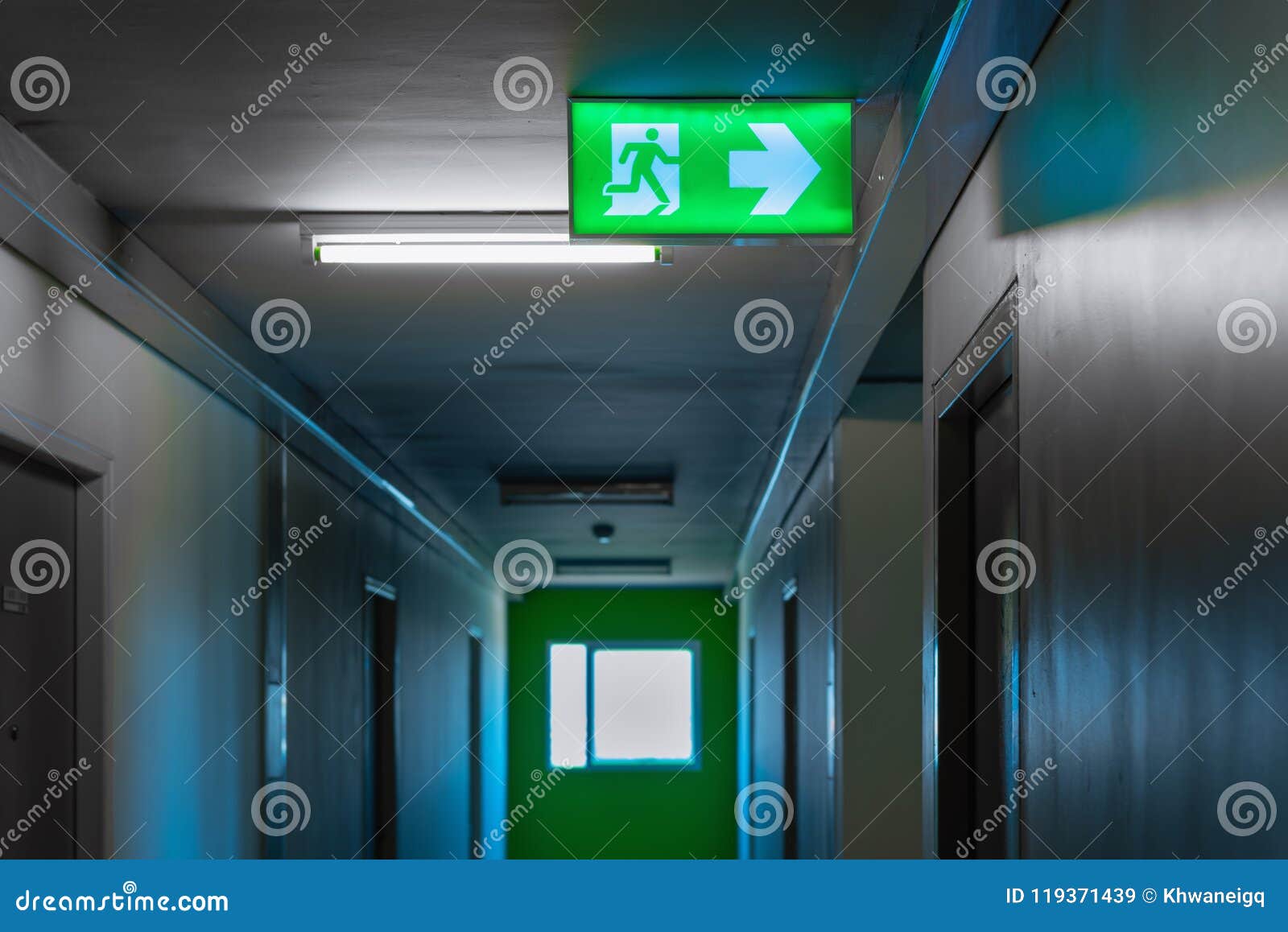 Fire Exit Sign Over Corridor Walkway in Apartment Building Stock Image ...