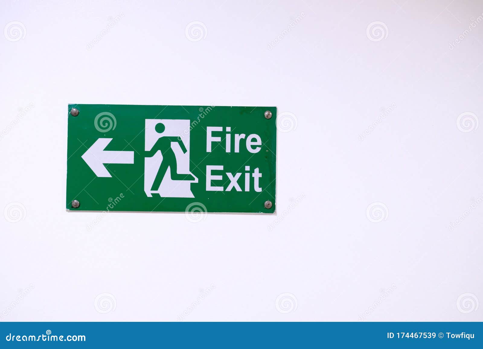 Fire Exit Sign on White Wall, Close Up Stock Image - Image of arrow ...